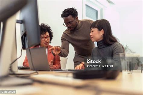 Multiethnic Group Of Tech Engineers Collaborate While Networking And