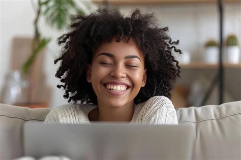 Premium Photo Woman Sitting On Couch With Laptop