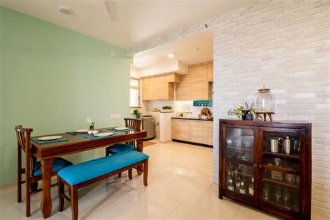 Compact Dining Room Design With Wooden Chairs And A Wide Bench Livspace