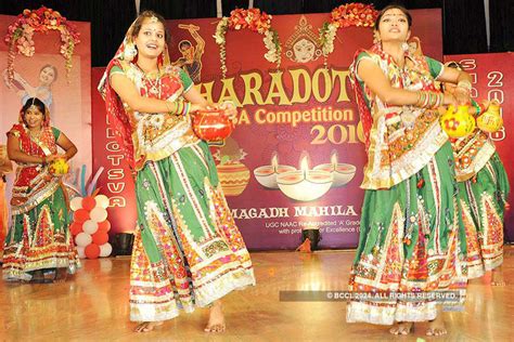 Indian Men And Women In Traditional Attire Perform Garba A Traditional