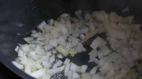 Fried Chopped Onion In The Hot Boiling Oil Closeup Of Frying Pan