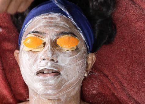 Facial Pack Mask Applied On Face Of A Lady With Hair Band With Eyes