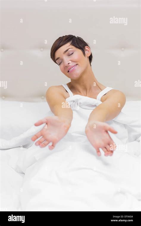 Girl Stretching In Bed Stock Photo Alamy