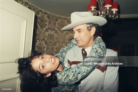 American Car Dealer Cal Worthington And Groupie Lori Mattix At A