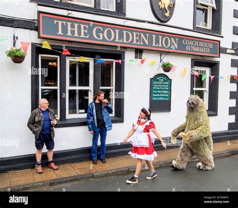 Street Artists Perform For Costumers Outside The Golden Lion Pub In