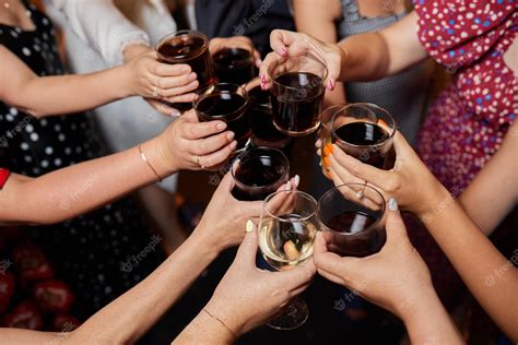 Premium Photo Celebrating With Glasses Of Alcohol In Hands Happy