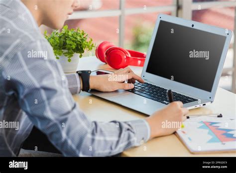 Businessman Writing Notes With Pen Inspired Ideas List On Paper Notepad