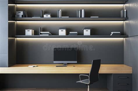 Modern Minimalist Workspace With Wooden Desk Black Chair Computer Monitor And Illuminated