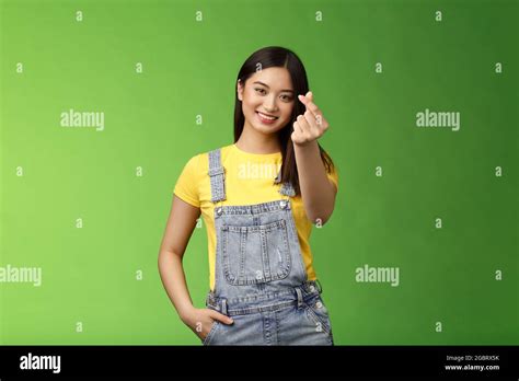 Lovely Tender Carefree Asian Girlfriend Show Korean Love Sign Make