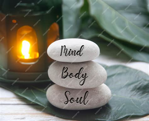 Premium Photo Mind Body And Soul Words Engraved On Zen Stones With