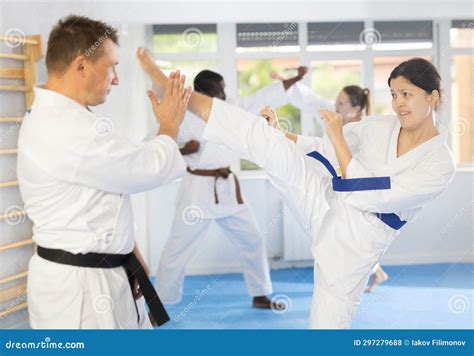 Middle Aged Woman Attendee Of Karate Classes Fighting With Her Opponent