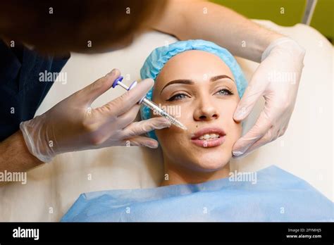 Woman Makes Rejuvenating Facial Injections Procedure For Lips
