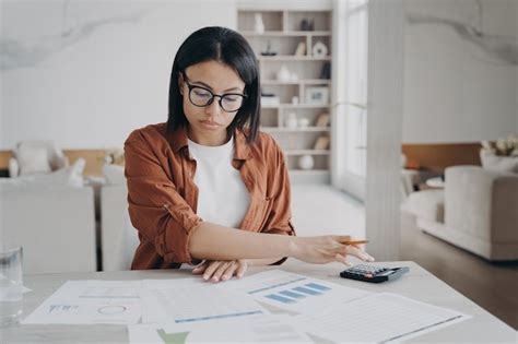 Premium Photo Focused Woman Freelancer In Glasses Count Financial