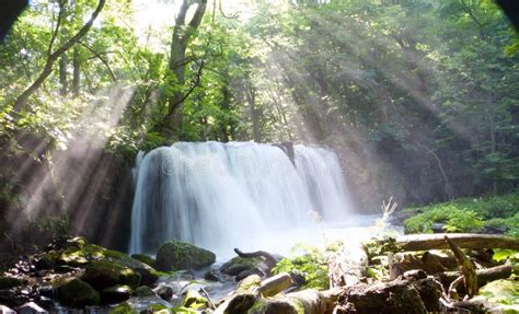Beautiful Shot Of Sun Rays Dropping On Choshi Waterfall Near Lake Towada In Aomori Japan Stock