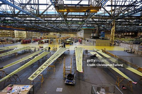Technicians Work On The Wing Of An Airbus A320 During Construction At