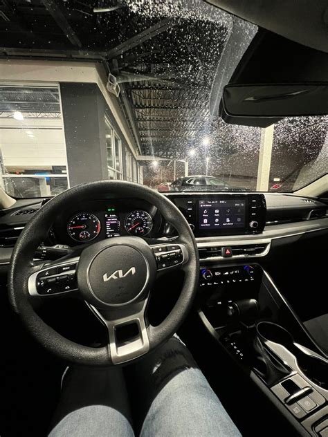 Luxury Car Interior With Rain Falling Kia K5 Wolf Grey Red Interior