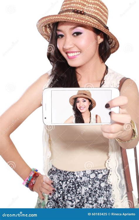 Happy Asian Woman Taking A Selfie Using Her Smartphone Stock Image