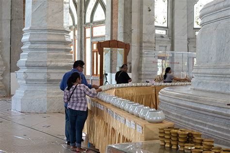 Pilgrims And Prayers Are Paying Respect To The Highly Famous Monk