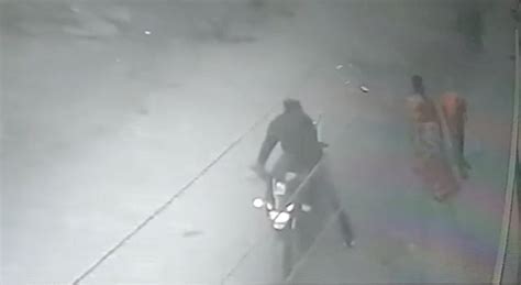 Snatching The Chain Of A Woman Cleaning Outside The House People Are