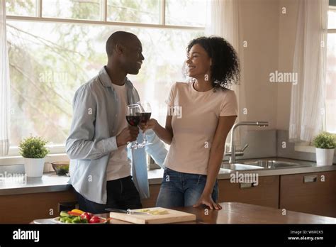 African Romantic Couple Clinking Glasses With Wine Enjoy Dating Stock