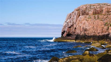 Sea Brown Rock Formation On Sea During Daytime Arctic Ocean Image Free