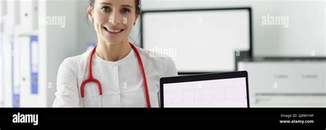 Doctor Cardiologist Showing Electrocardiogram On Digital Tablet Stock