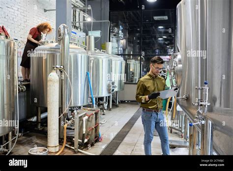 Man And Woman Working In Craft Brewery Stock Photo Alamy