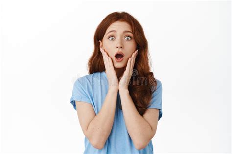Surprised Redhead Woman Drop Jaw Gasp And Say Wow Staring In Awe At