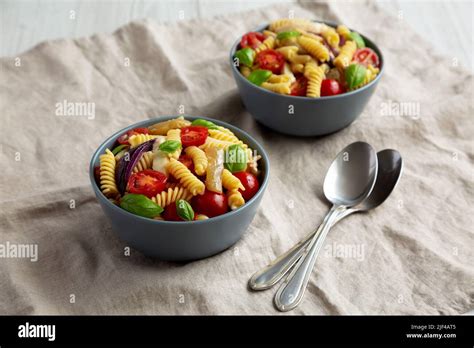 Homemade Fusilli Pasta Salad with Mozzarella and Vegetables, side view ...
