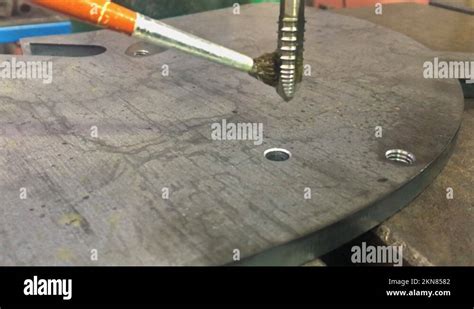 The Process Of Threading In Metal On A Drilling Machine Stock Video Footage Alamy