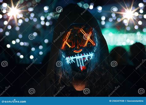 Man In Glowing Mask Sitting In The Corner With Moon Shaped Lamp Royalty