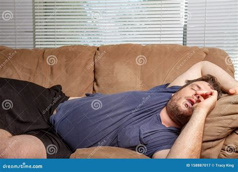 Fat Tired Man Passed Out On The Couch Stock Image Image Of Inside