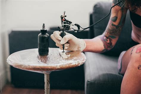 A Woman Tattooing Itself By Stocksy Contributor Vera Lair Stocksy