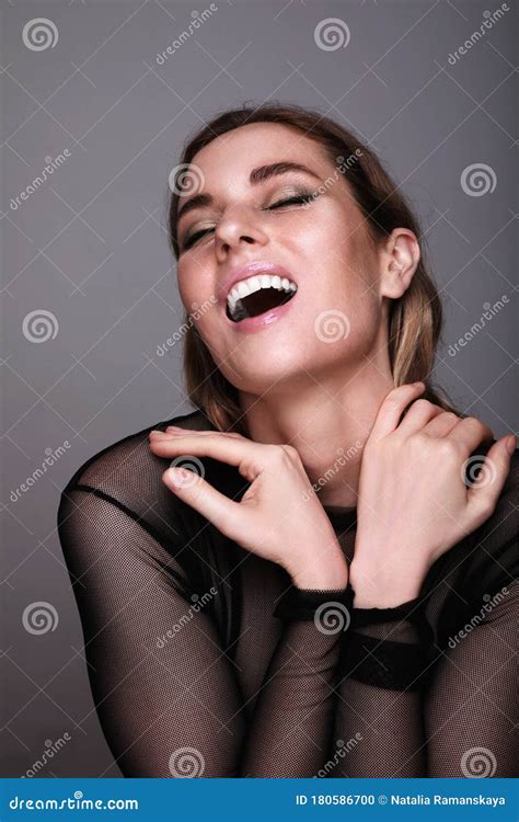 Vertical Portrait Of Attractive And Girl With Happy Face Posing In The