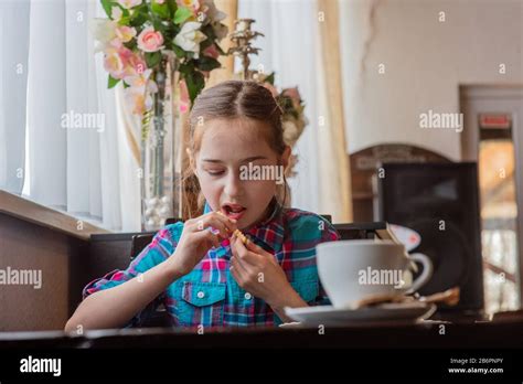 Pretty Girl Eating French Fries Girl Eating French Fries In A Cafe