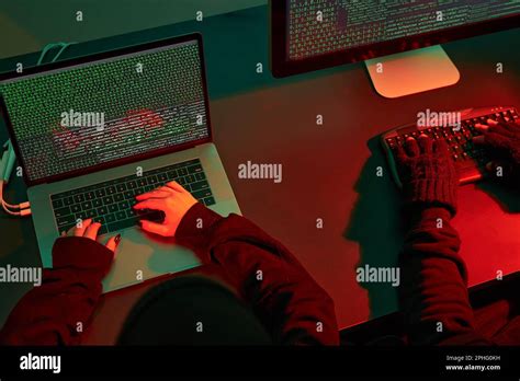 Anonymous People Using Computer And Programming To Break Code Cyber