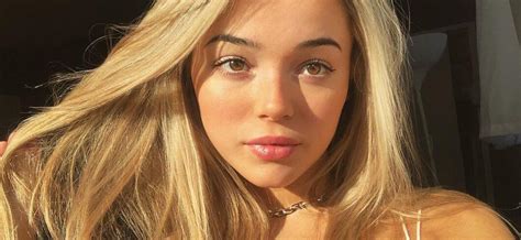 Olivia Dunne Soaks Up The Sun Poolside In Her Tiny Pink Bikini
