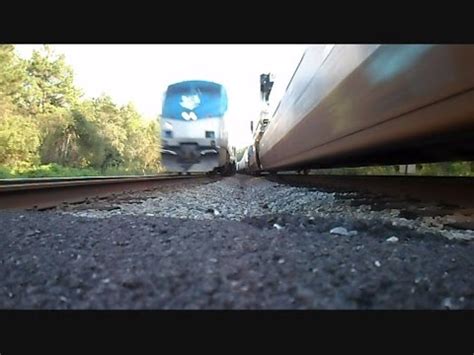 Amtrak Train Races CSX Train Knocks Over Cameras YouTube