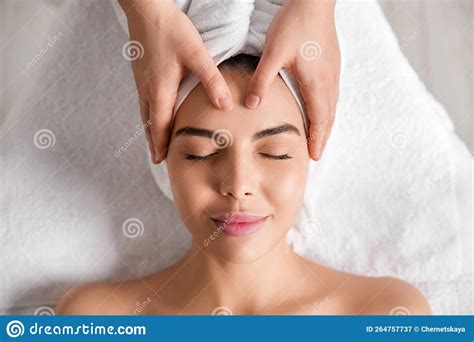 Beautiful Woman Receiving Facial Massage In Beauty Salon Closeup Top