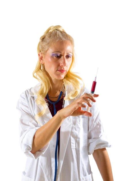 Premium Photo Doctor Holding Injection While Standing Against White