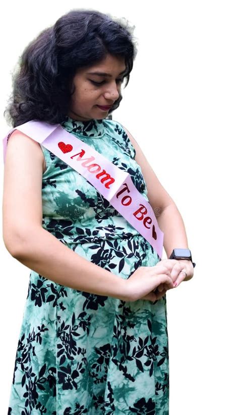 A Pregnant Indian Lady Poses For Pregnancy Shoot And Hands On Belly