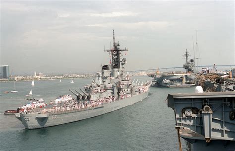 Tugs Maneuver The Battleship USS MISSOURI BB 63 Into A Berth Between
