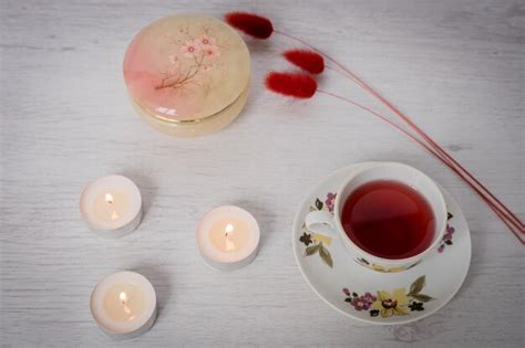 High Angle View Of Tea With Illuminated Tea Lights On Table Premium Photo