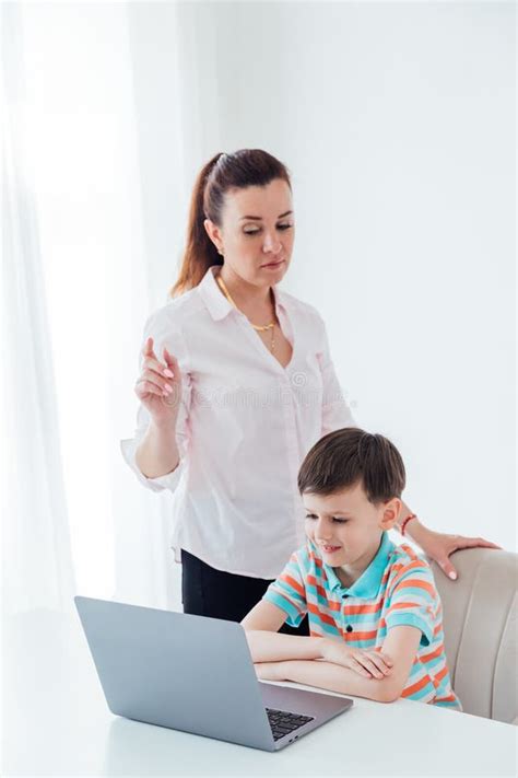 Men Teaching Boy On Laptop In School Classroom Stock Image Image Of