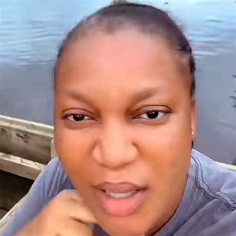 Lady Uses Canoe For Transportation As Street Floods After Rainfall