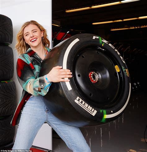 Chloe Grace Moretz Shows Off Her Strength As She Lifts A Wheel Outside
