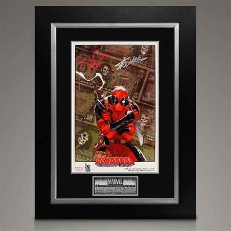 The Deadpool Poster Is Framed In A Black Frame With A White Background