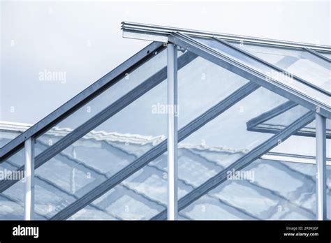 Greenhouse Construction Made Of Glass And Metal Framing Is Under Bright