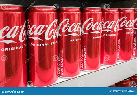 Row Of Red Cans Of Coca Cola Original Taste On A Shelf In A Store Editorial Stock Image Image