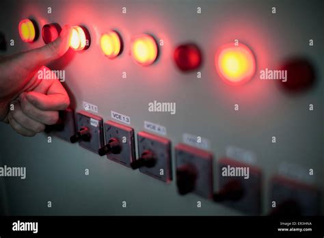 Worker Pressing Illuminated Buttons On Industrial Control Panel Stock Photo Alamy